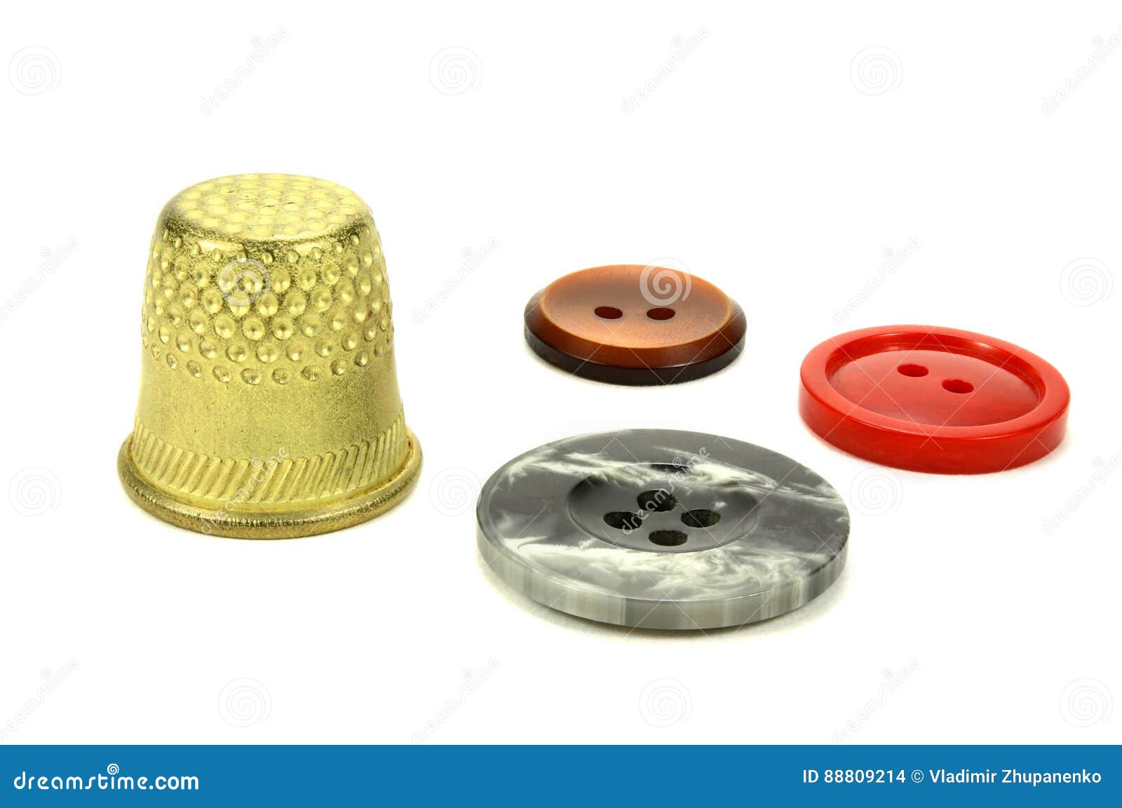 Old Brass Thimble and Color Buttons for Sewing on a White Background ...