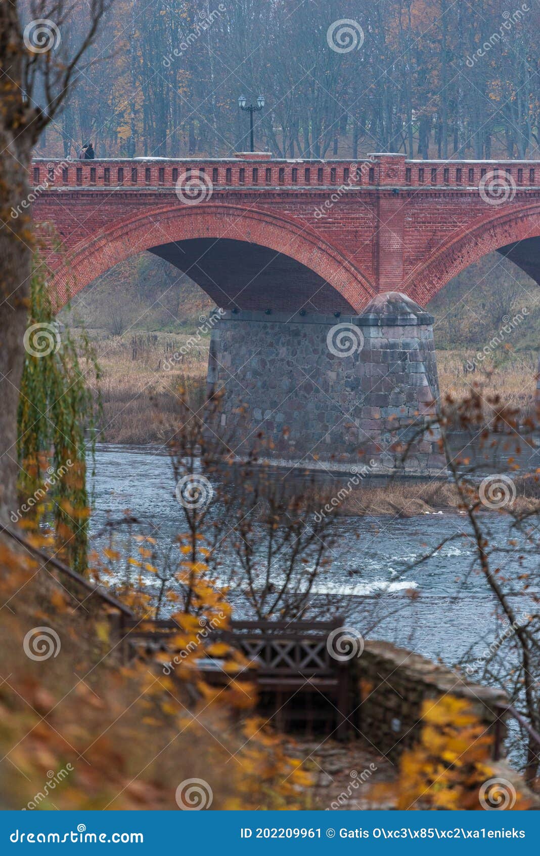 Old brick bridge in autumn stock image. Image of summer - 202209961