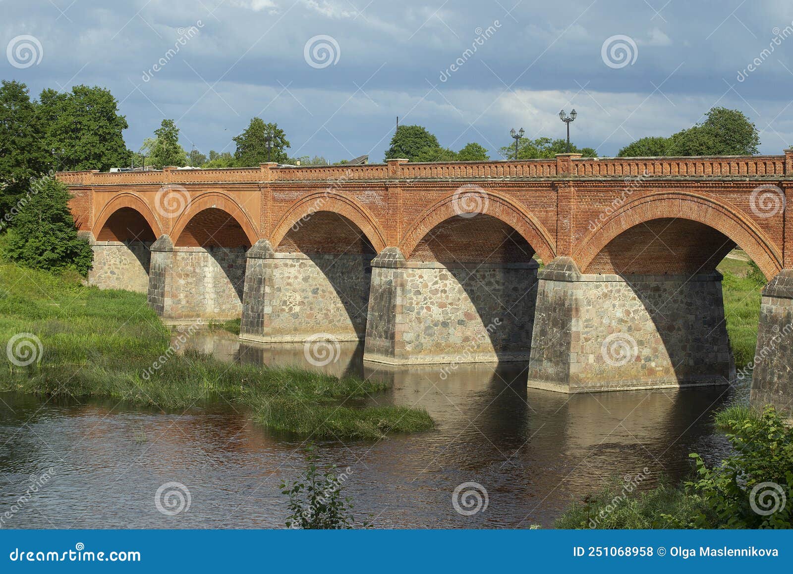 An Old Brick Bridge with a Reflection in the River Stock Photo - Image ...