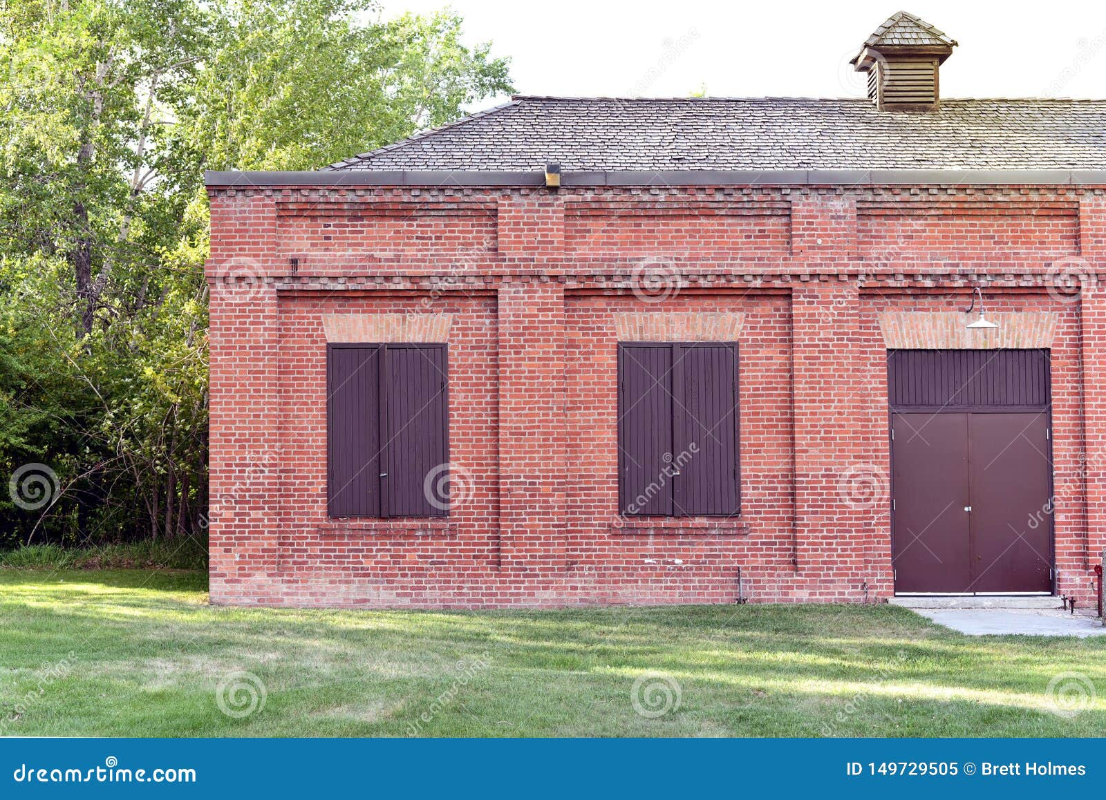 Brick Building with Shuttered Windows Stock Image - Image of colorful ...