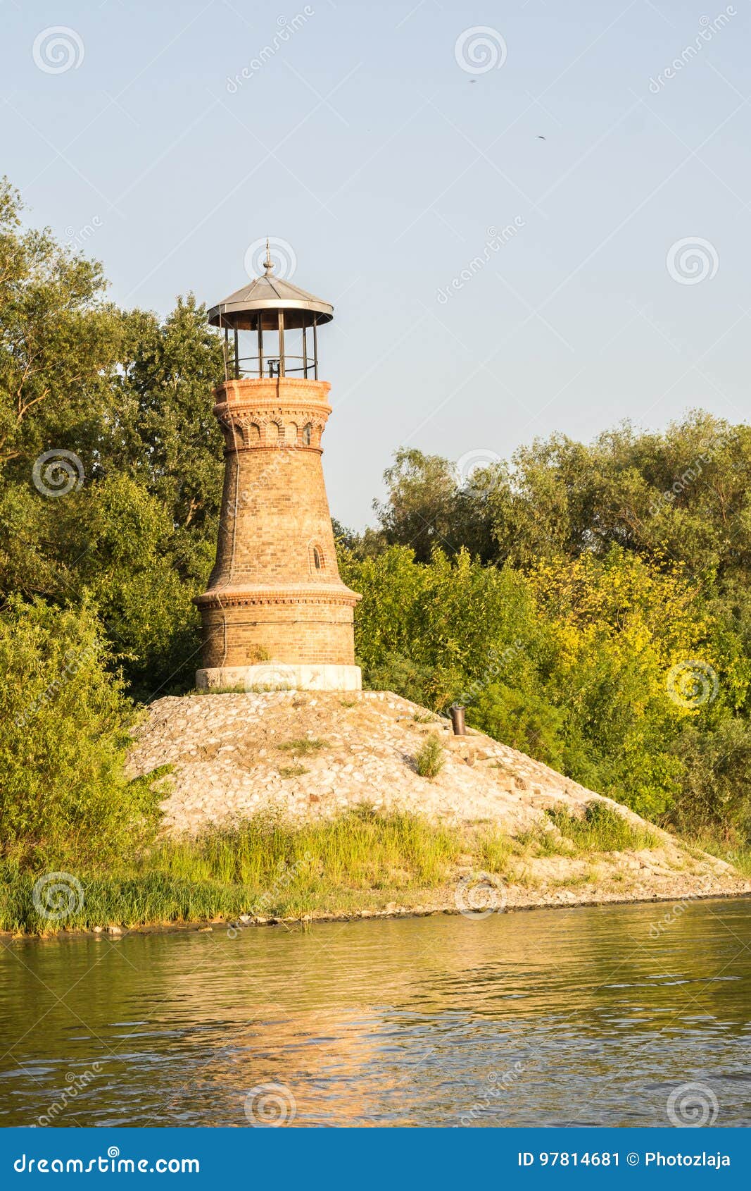 Old Brick Lighthouse on the River with Clear Sky Stock Image - Image of ...