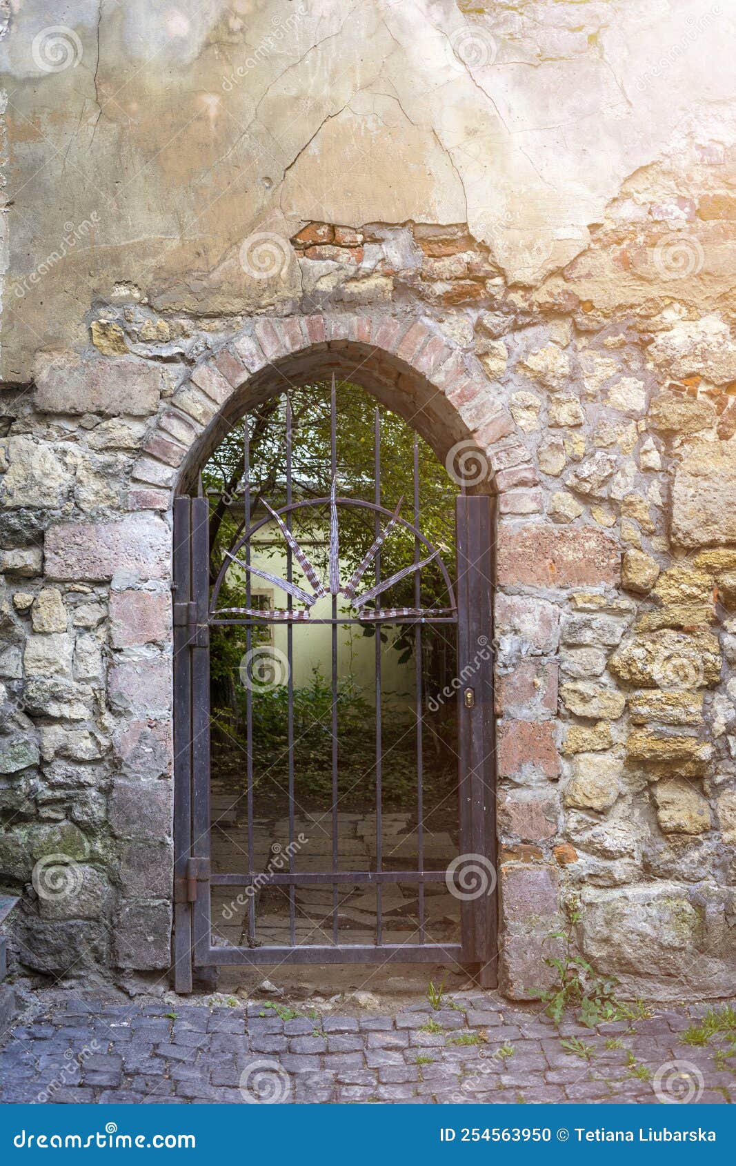 Old Brick Wall with Shackled Gates. Stock Photo - Image of ruins ...