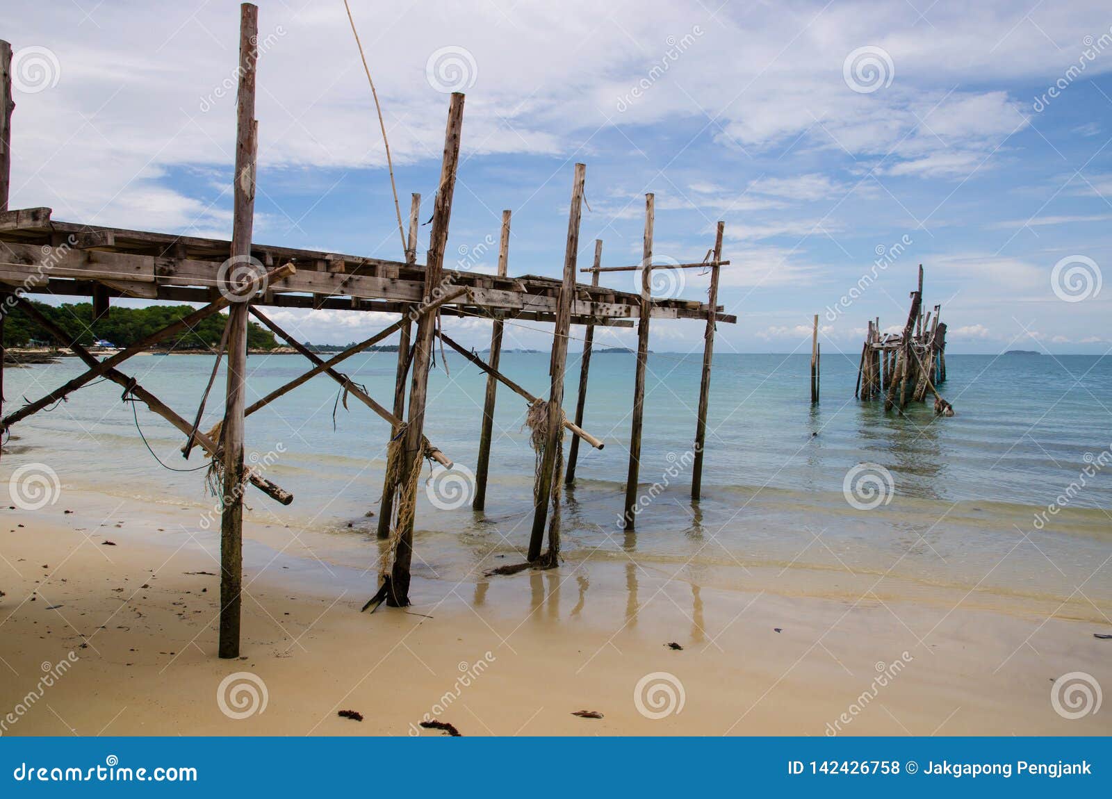 Old bridge on beach stock photo. Image of bridge, cloud - 142426758