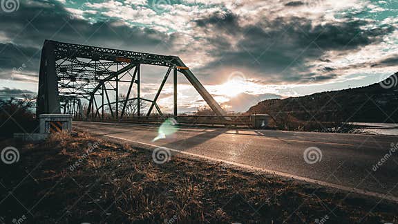An old bridge at sunset stock image. Image of reflection - 273337801