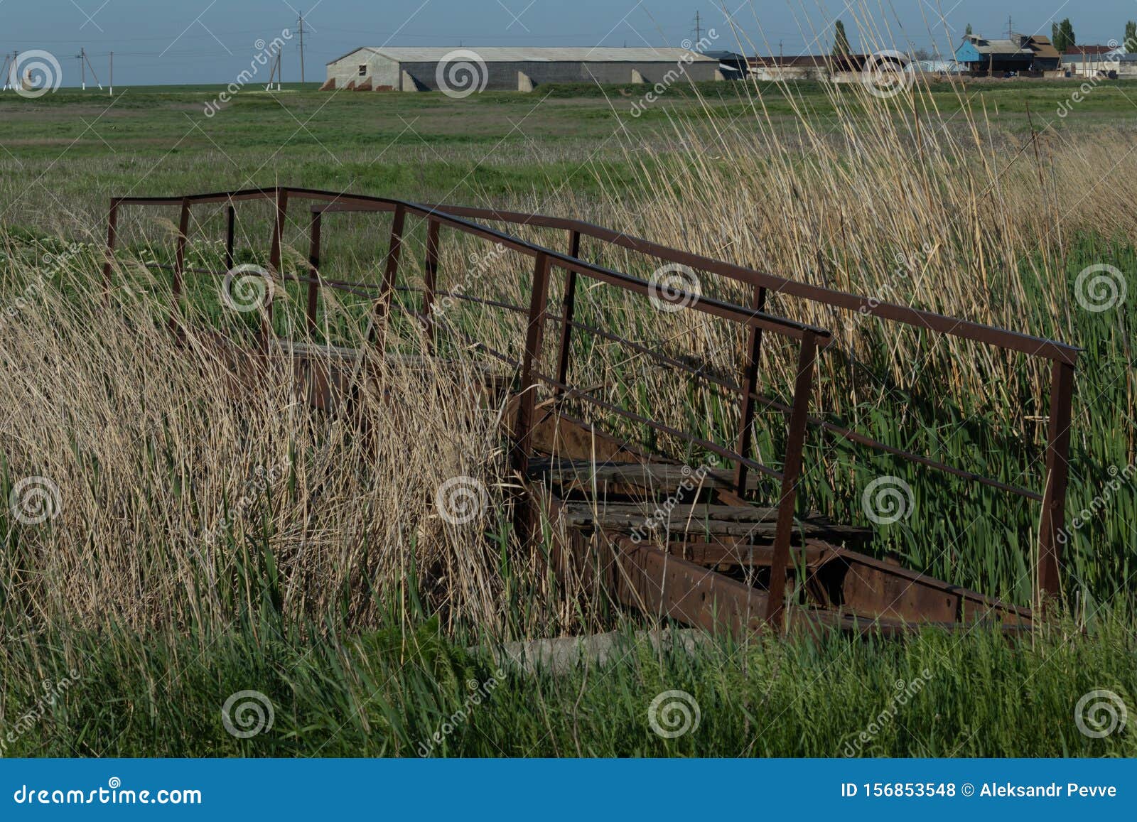 Old Broken Bridge Over the River Near the Farm Buildings Stock Photo ...