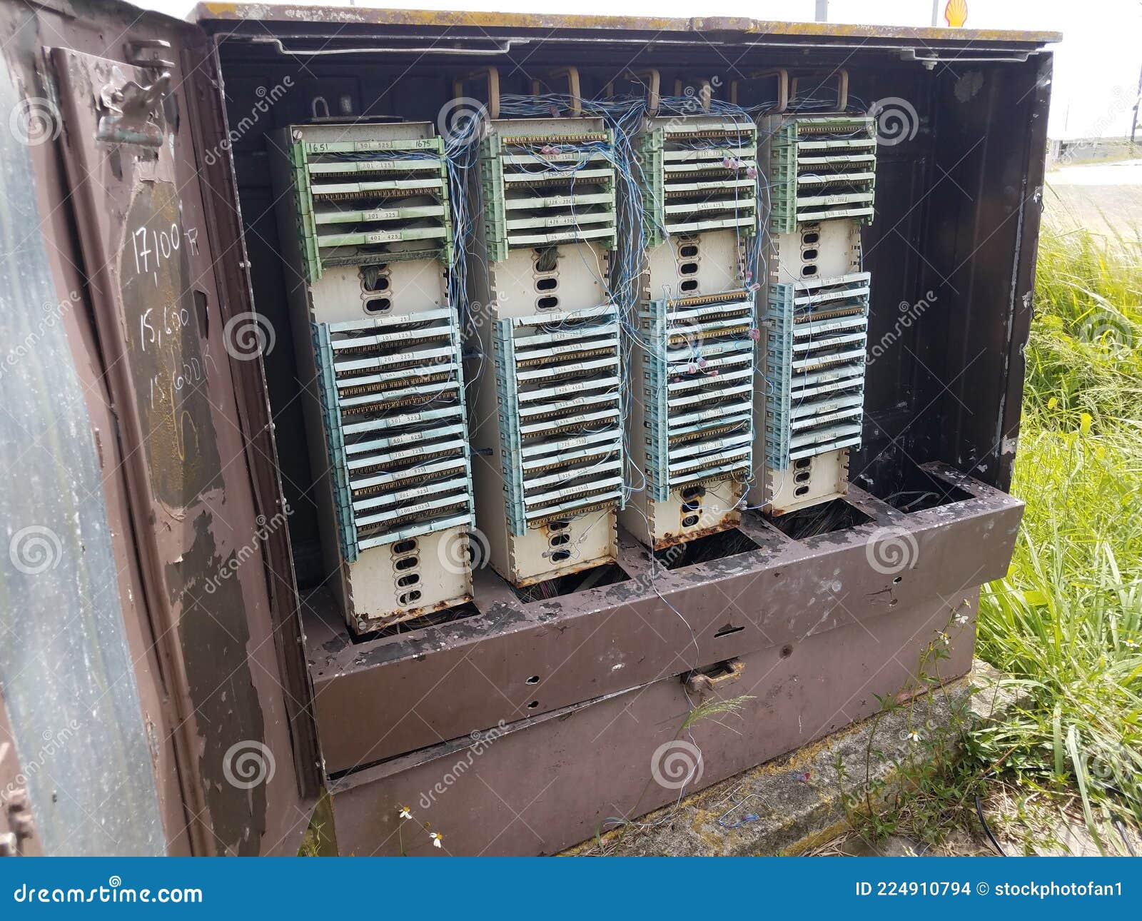 Broken Electrical Box On Ground With Wires And Leaves Stock Photo ...