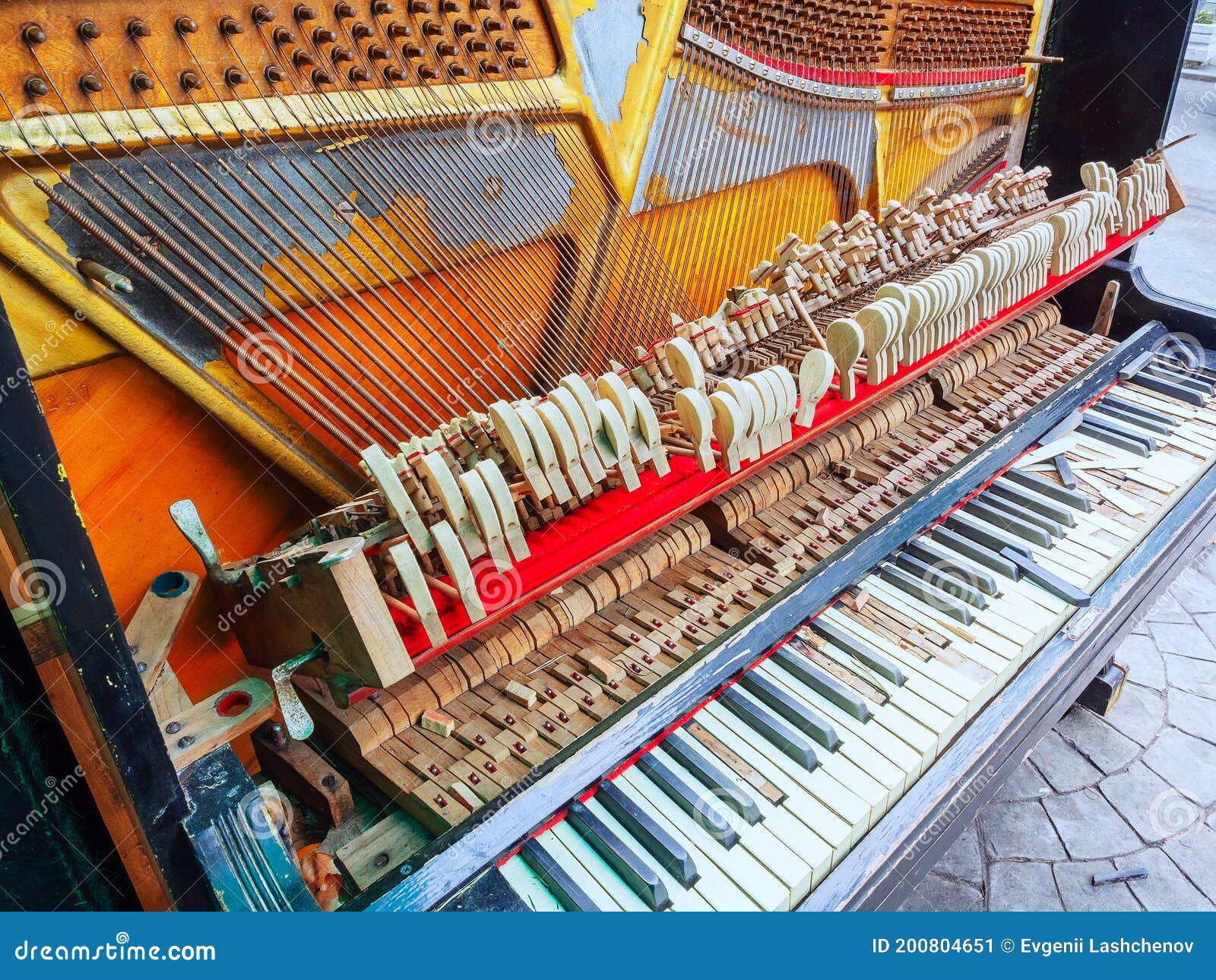 An Old Broken Piano with a Missing Wall and Broken Keys Stock Image ...