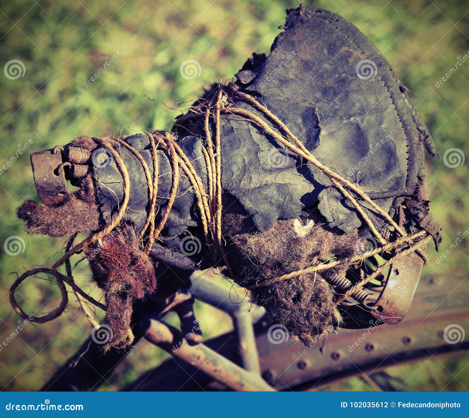 Old Broken Saddle of a Bicycle Fixed with String Stock Photo - Image of ...