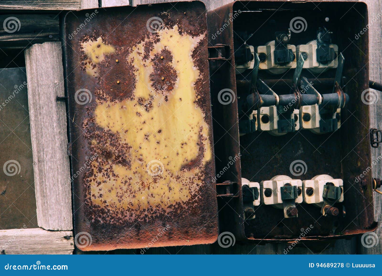 Old Broken Switchboard on a Wooden Wall .disassembled, Plundered ...