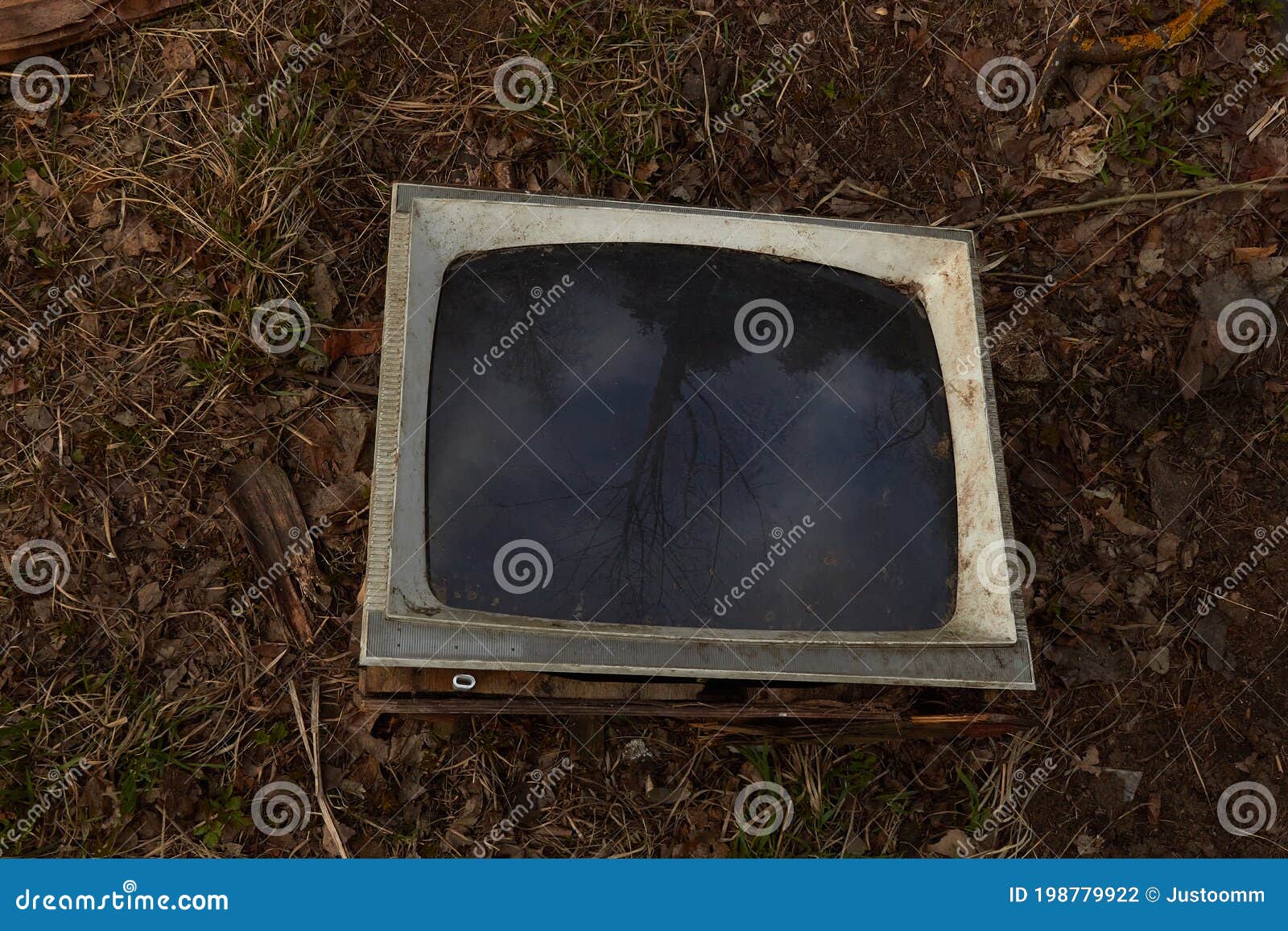 Old Broken TV on the Ground with a Black Screen Stock Photo - Image of ...