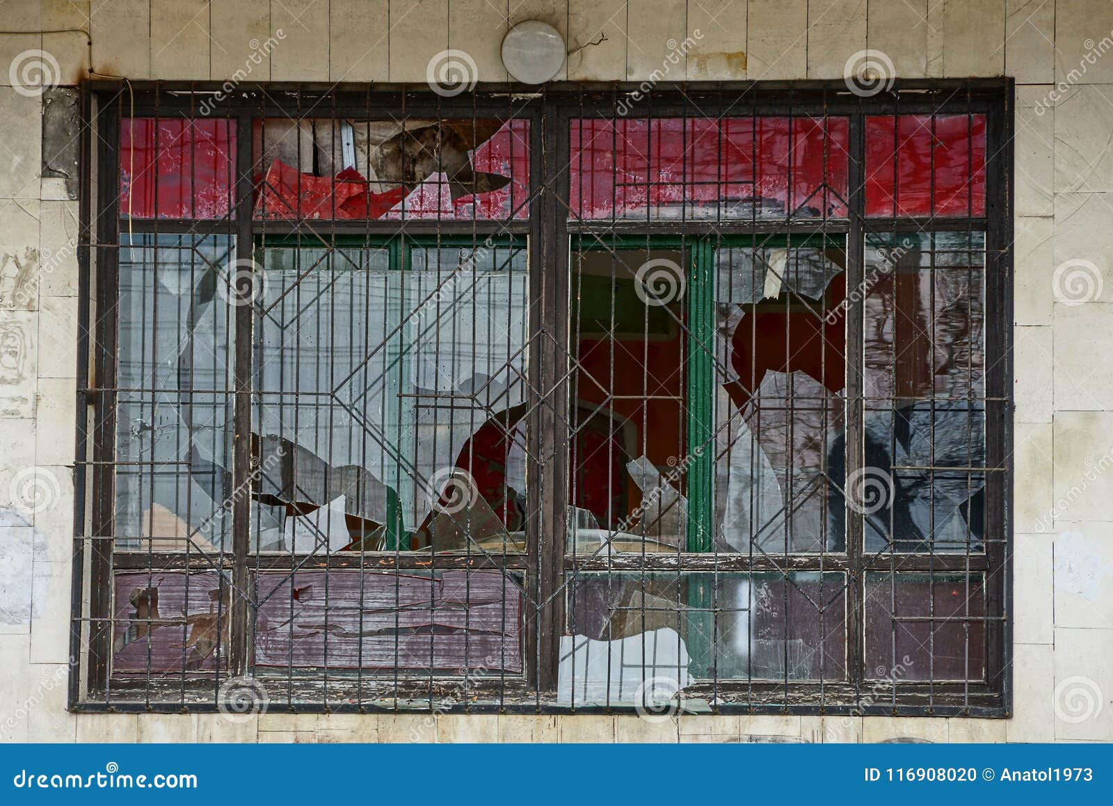 Old Broken Window with a Grill on a Gray Wall Stock Photo - Image of ...