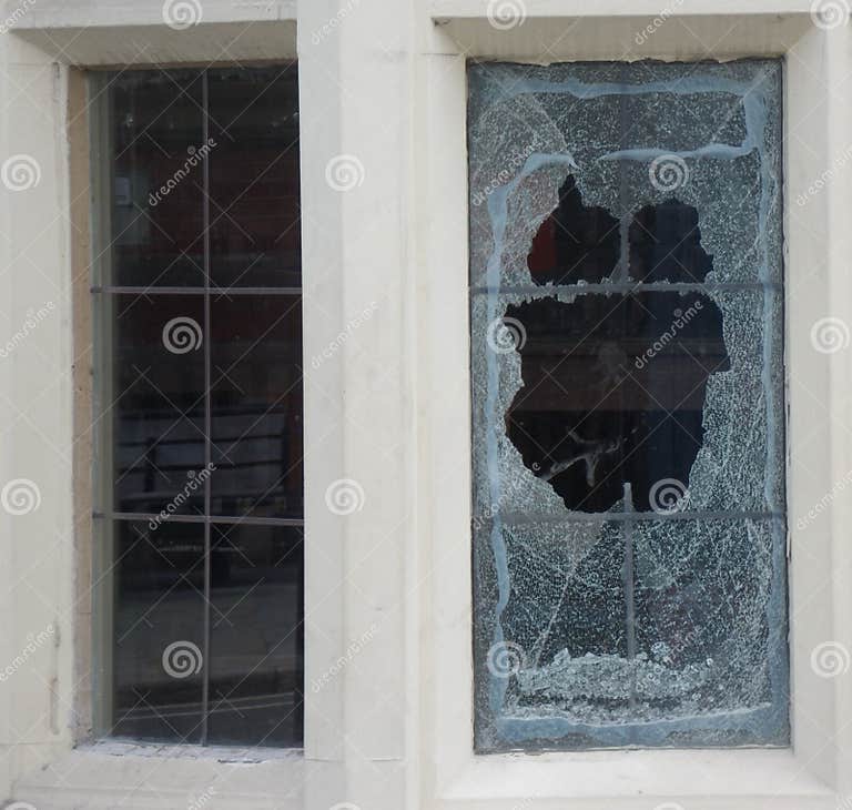 An Old Broken Window that Looks Like a Ghost S Face Stock Photo - Image ...