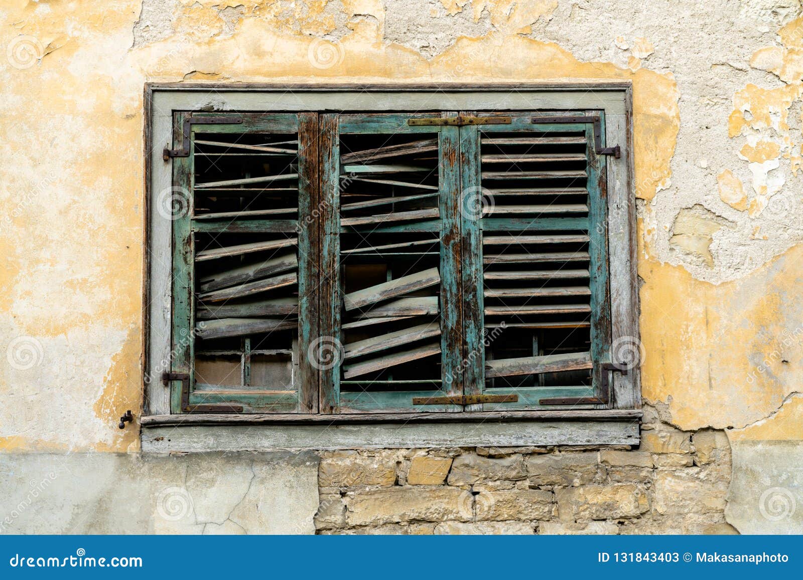 Old Broken Window Shutters on a Dilapidated and Run Down House Front ...