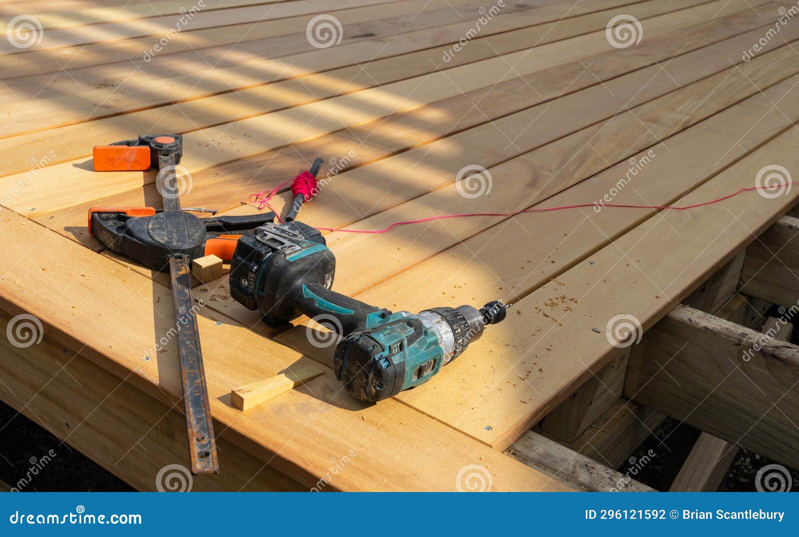 Old Builders Tools and Red String on New Wooden Decking Under ...