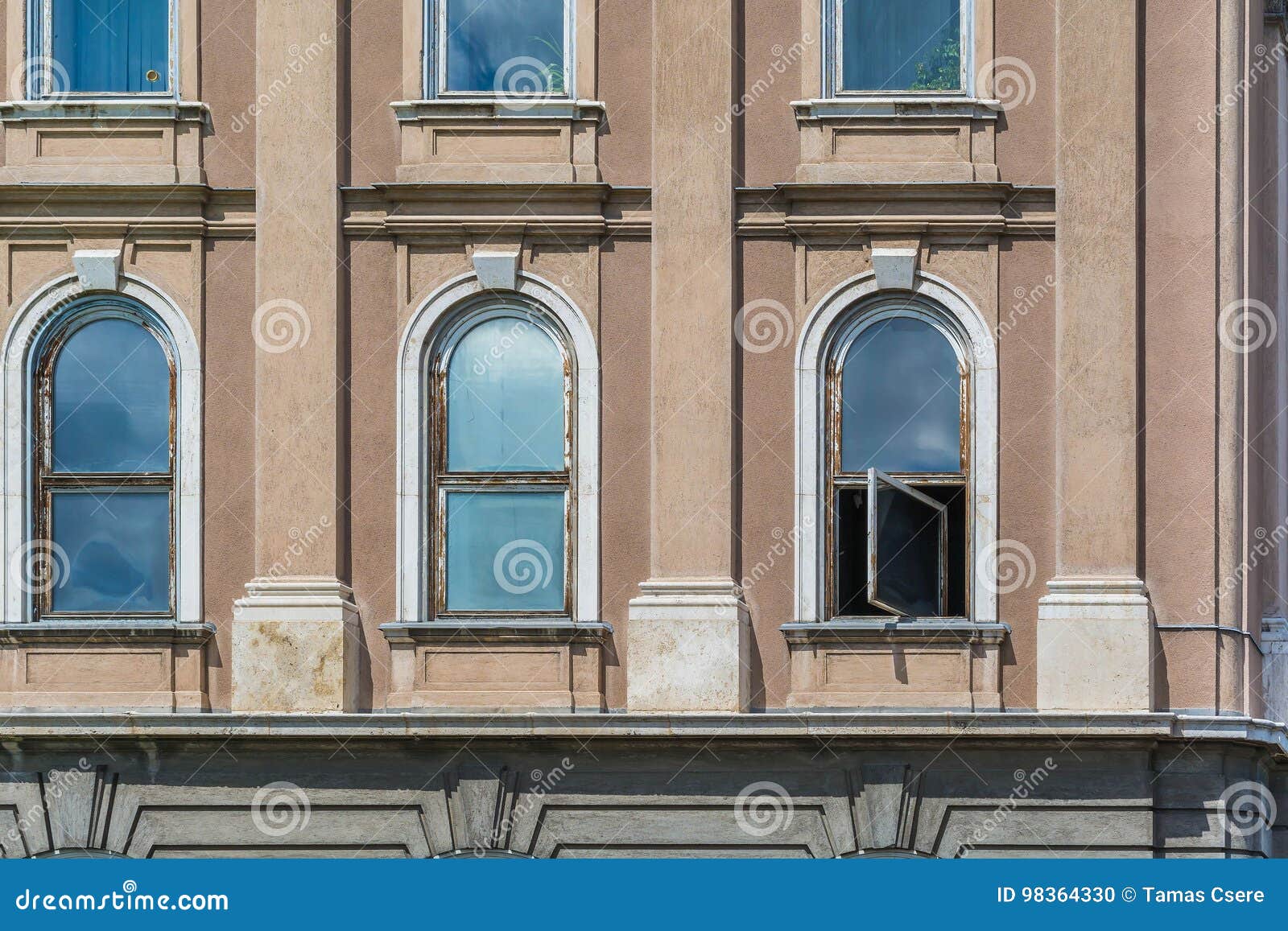 Old Building Facade with Blue Sky Reflection in Windows. One Open ...