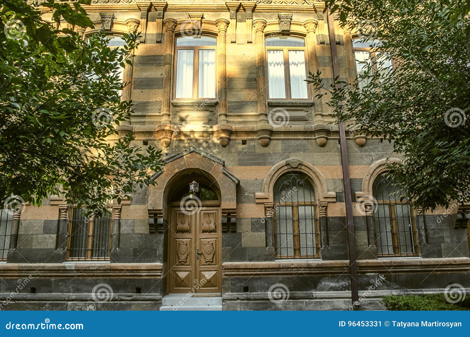 Old Building of Multicolored Tufa Stone with Carved Arches Stock Image ...