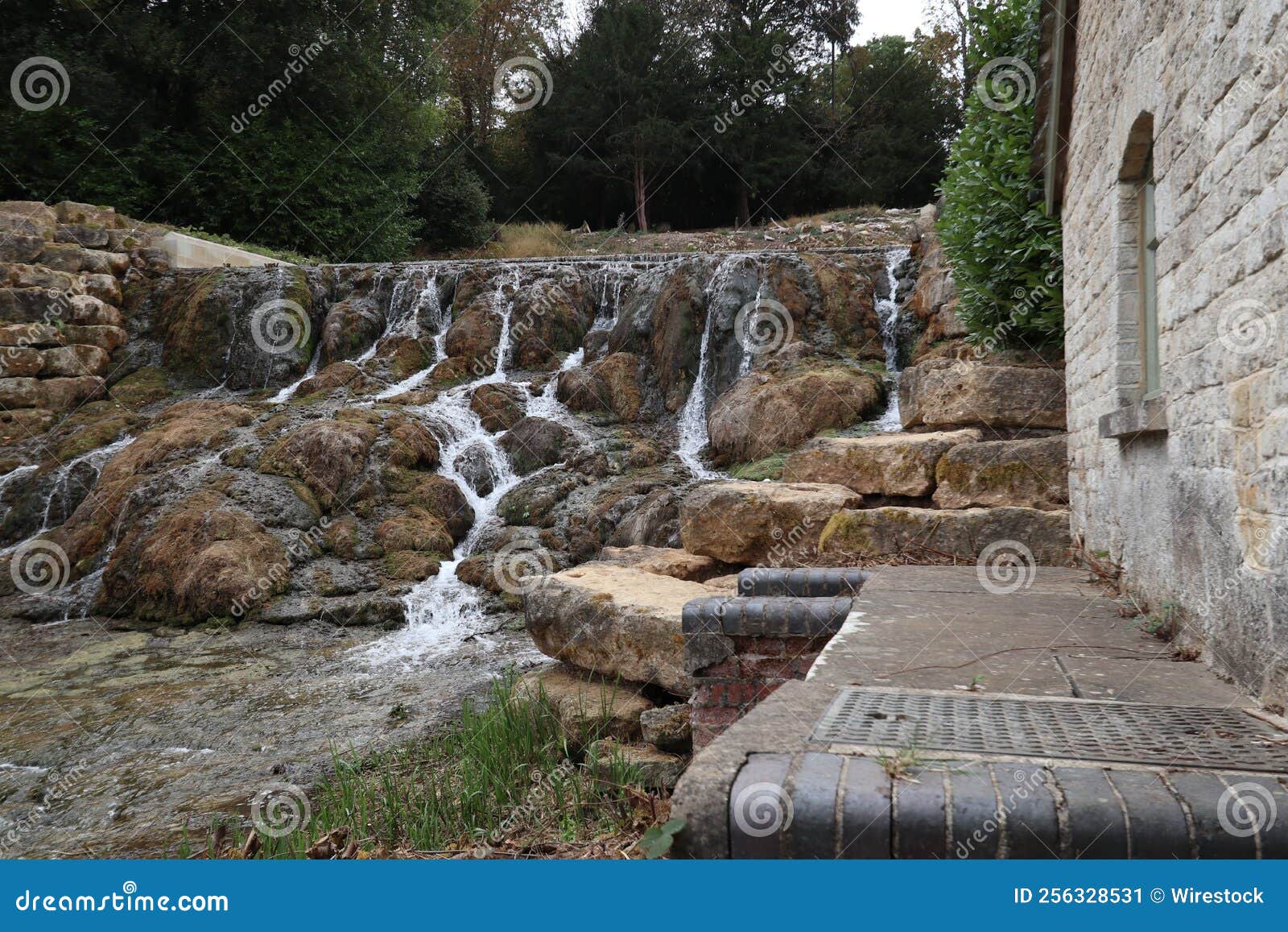 Old Building and Rocky Waterfall Flowing Downstream in a Forest Stock ...