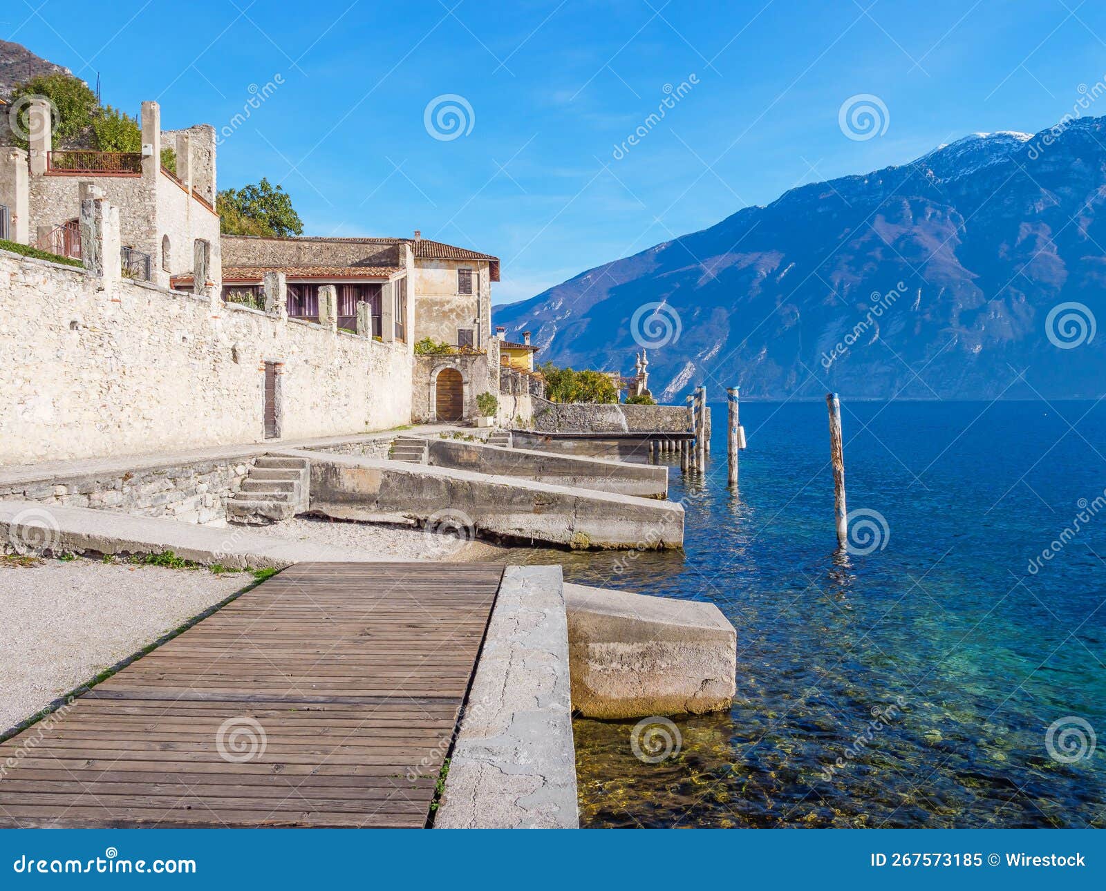 Old Buildings at the Shore on the Background of the Hills Stock Image ...
