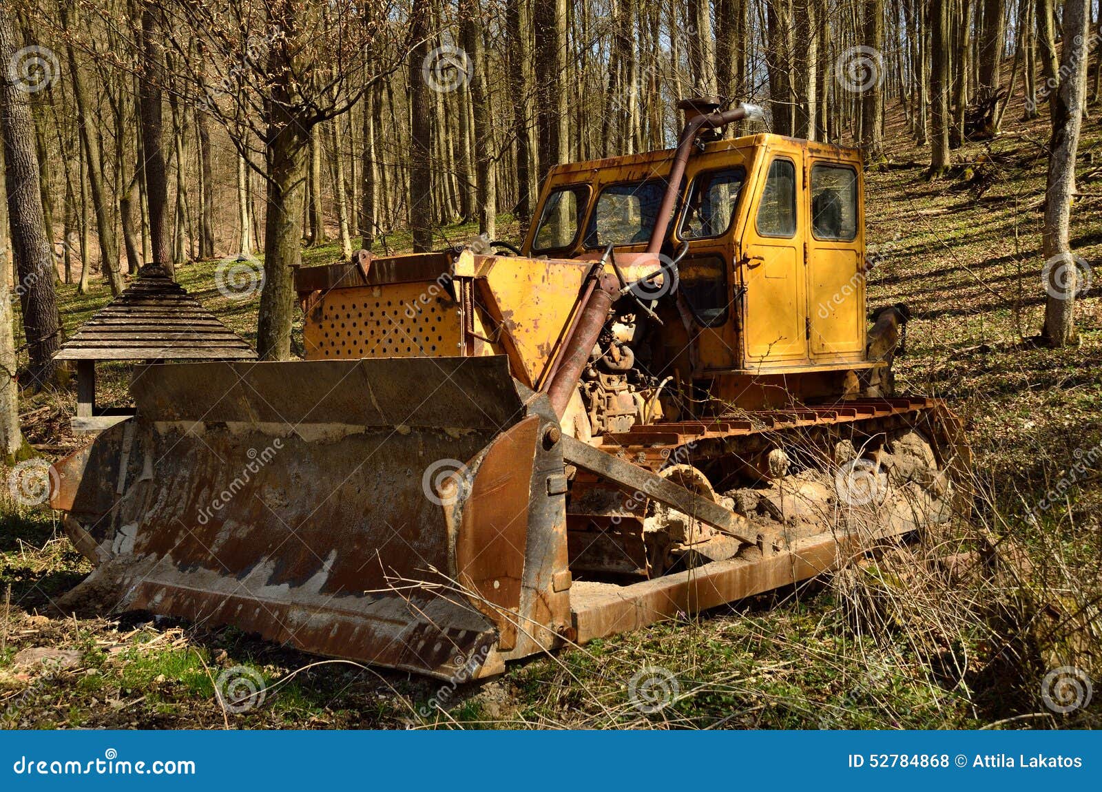 Old bulldozer in a forest stock photo. Image of construct - 52784868