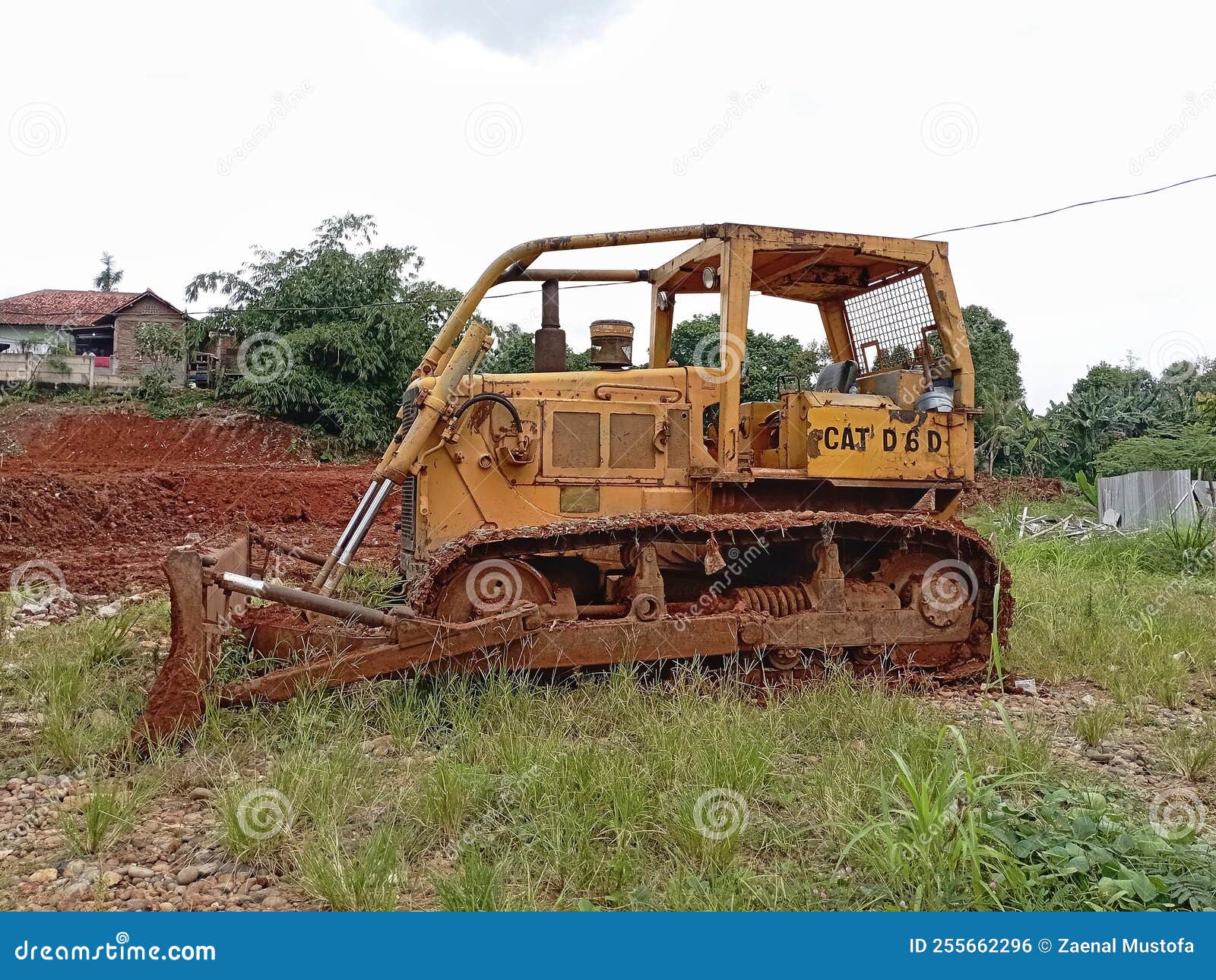 An Old Bulldozer Leveling the Construction Ground Stock Photo - Image ...