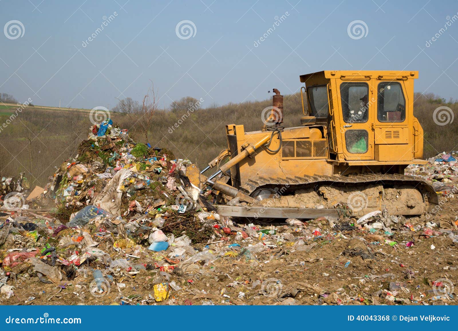 The Old Bulldozer Moving Garbage Stock Photo - Image of moving, dispose ...