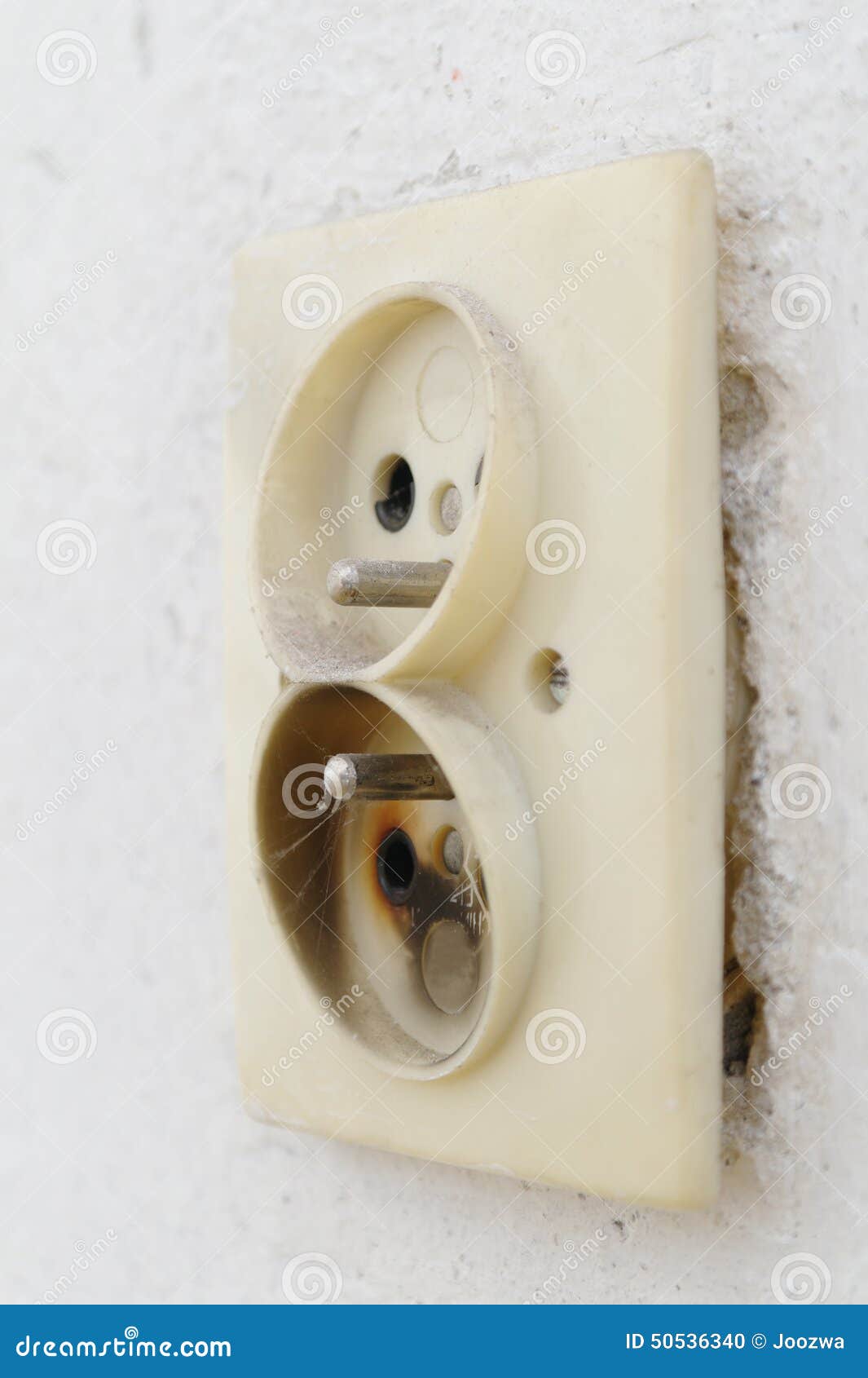 Old burnt plug in a wall stock photo. Image of wall, melt - 50536340