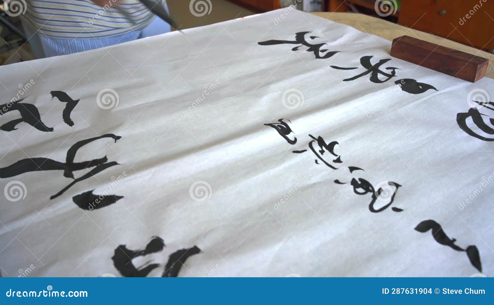 An Old Calligrapher is Writing Calligraphy Characters, Creating ...