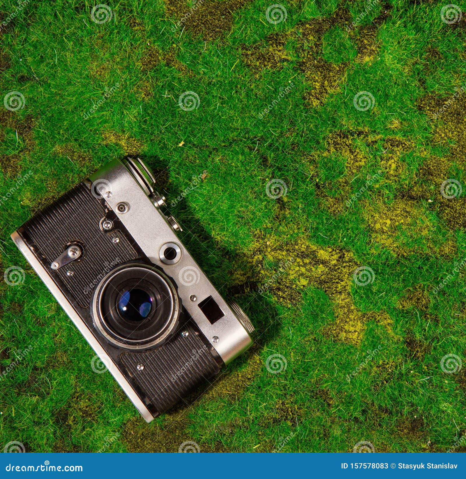 Camera in grass stock image. Image of modern, black - 157578083