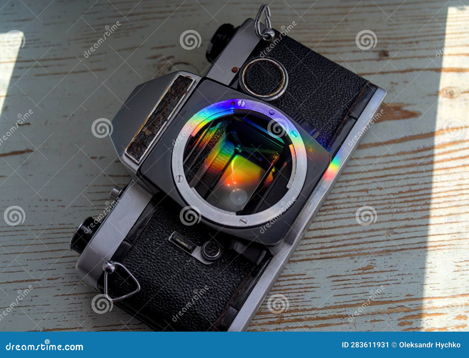 Old Camera Under Rainbow Color Sun Beam on Wooden Plank Texture. Stock ...
