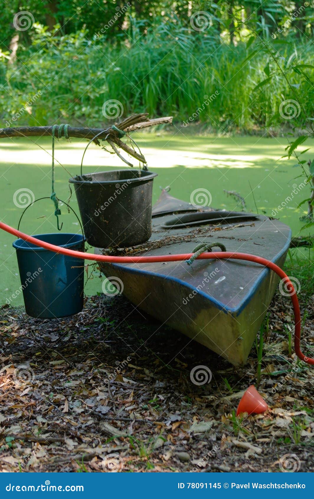 Old Canoe Ashore the Pond with Bucket on it Stock Image - Image of ...
