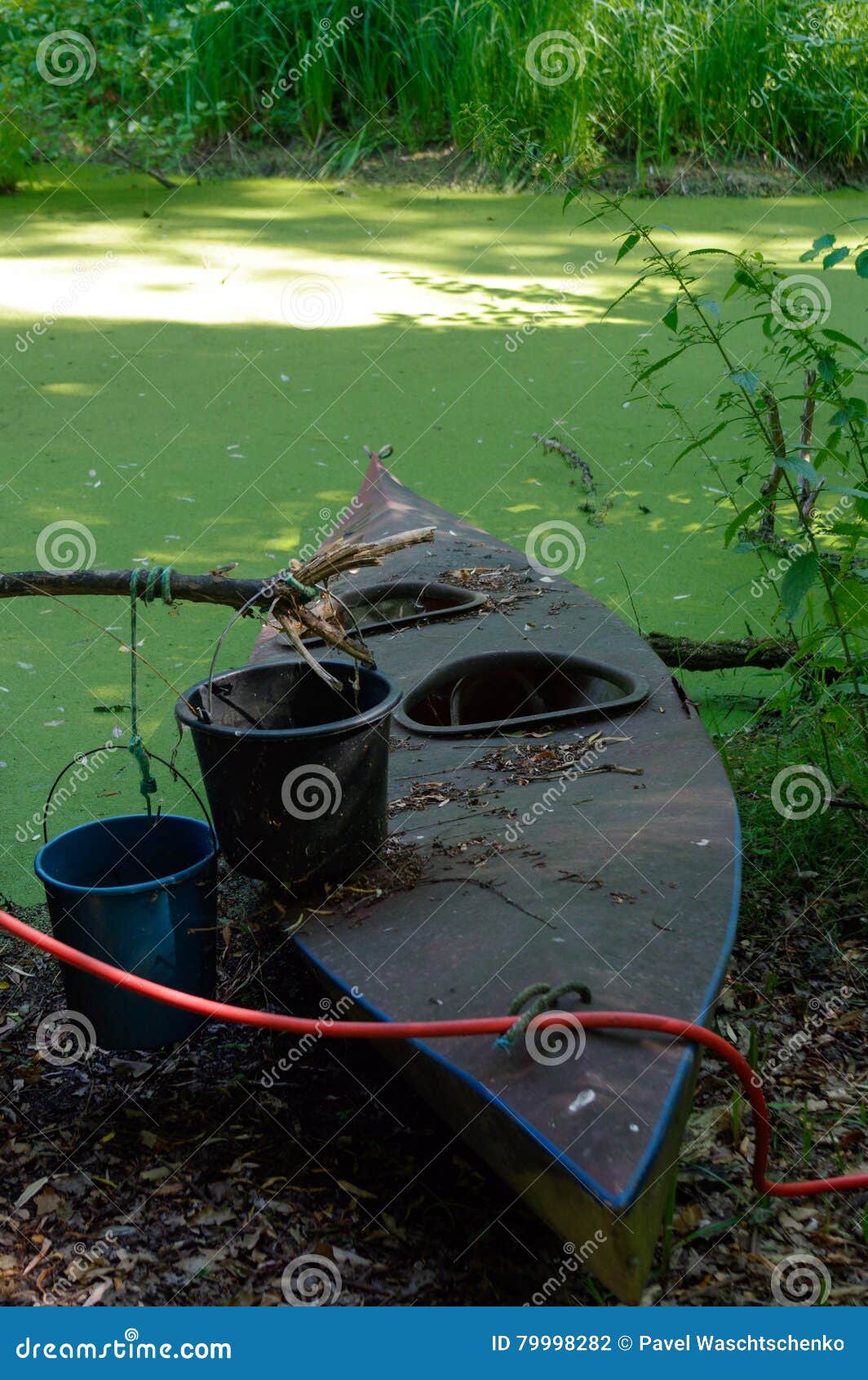 Old Canoe Ashore the Pond with Bucket on it Stock Photo - Image of park ...