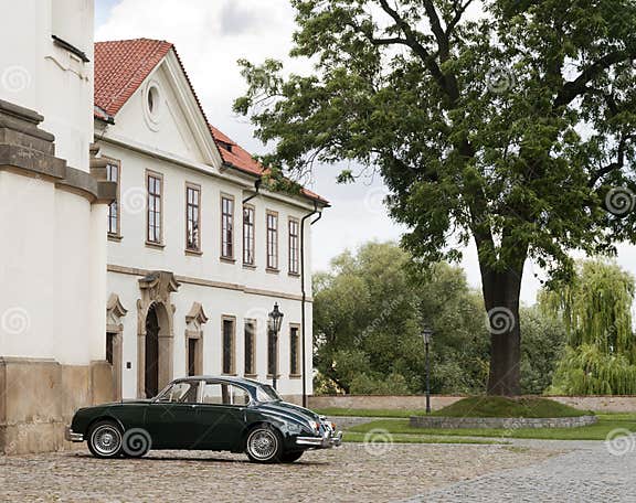Old Car in Front of a Mansion Stock Photo - Image of tree, residence ...