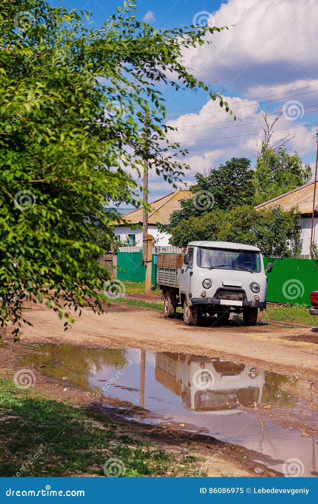 Old Car in a Puddle Reflection Stock Image - Image of city, buildings ...