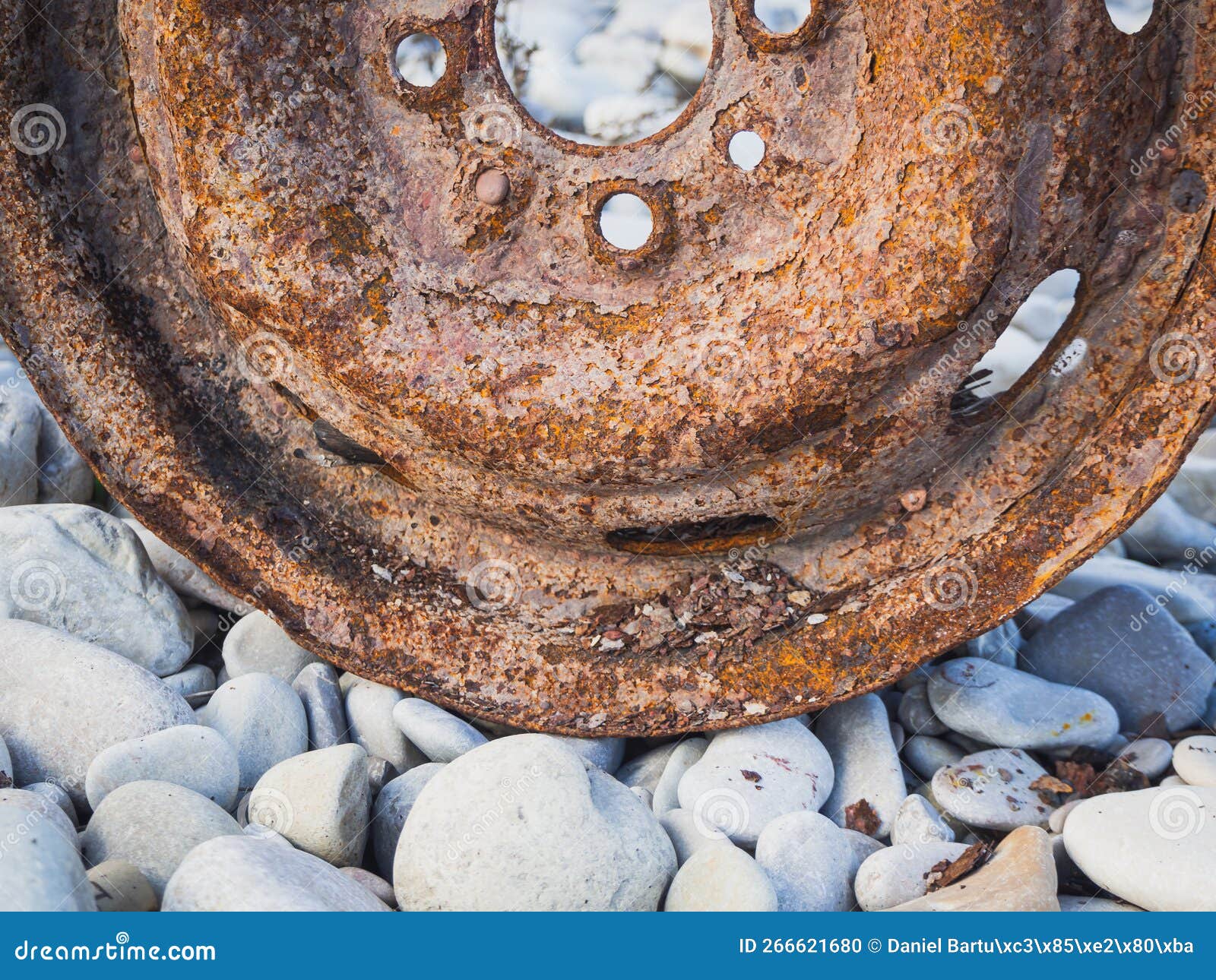 Old Car Wheel, Rusty Car Alloy Rim on Stones by the River Stock Photo ...