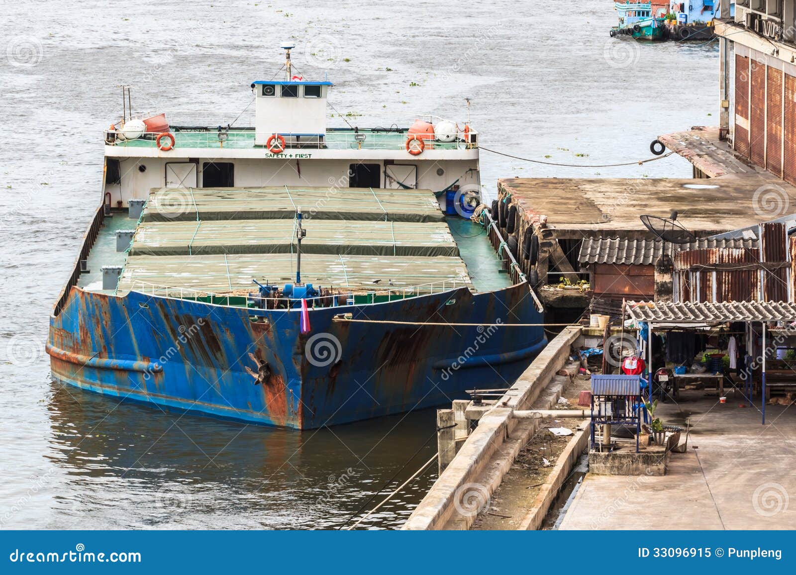 Old Cargo Ship Docked at the Wharf in the River Stock Image - Image of ...