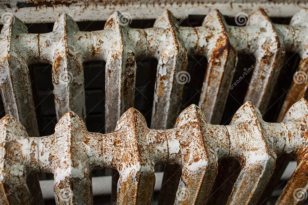 Old Cast-iron Battery. Vintage Rusty Battery Section. Stock Photo ...