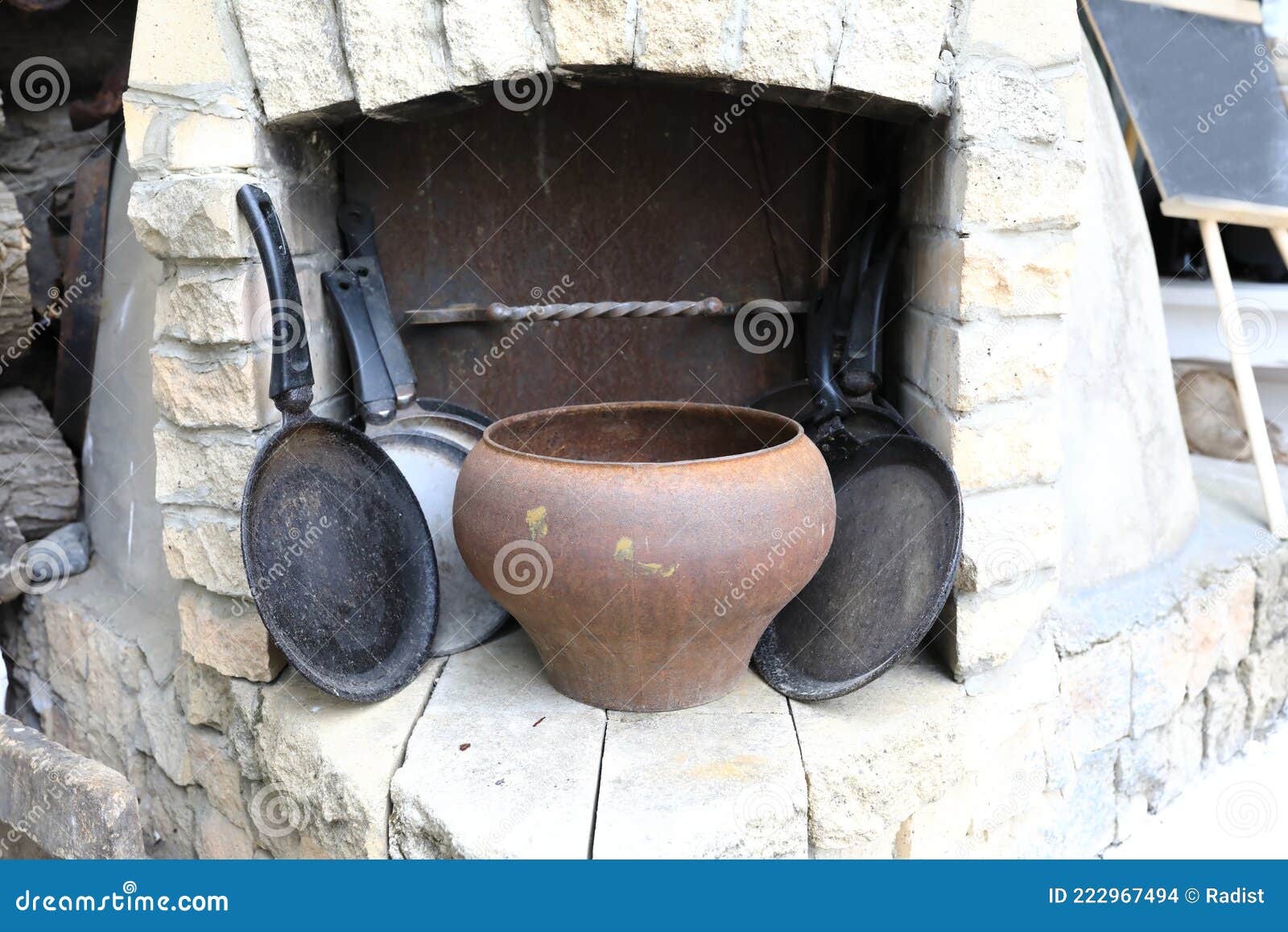 Old Cast Iron Cookware in Stone Oven Stock Photo - Image of abstract ...