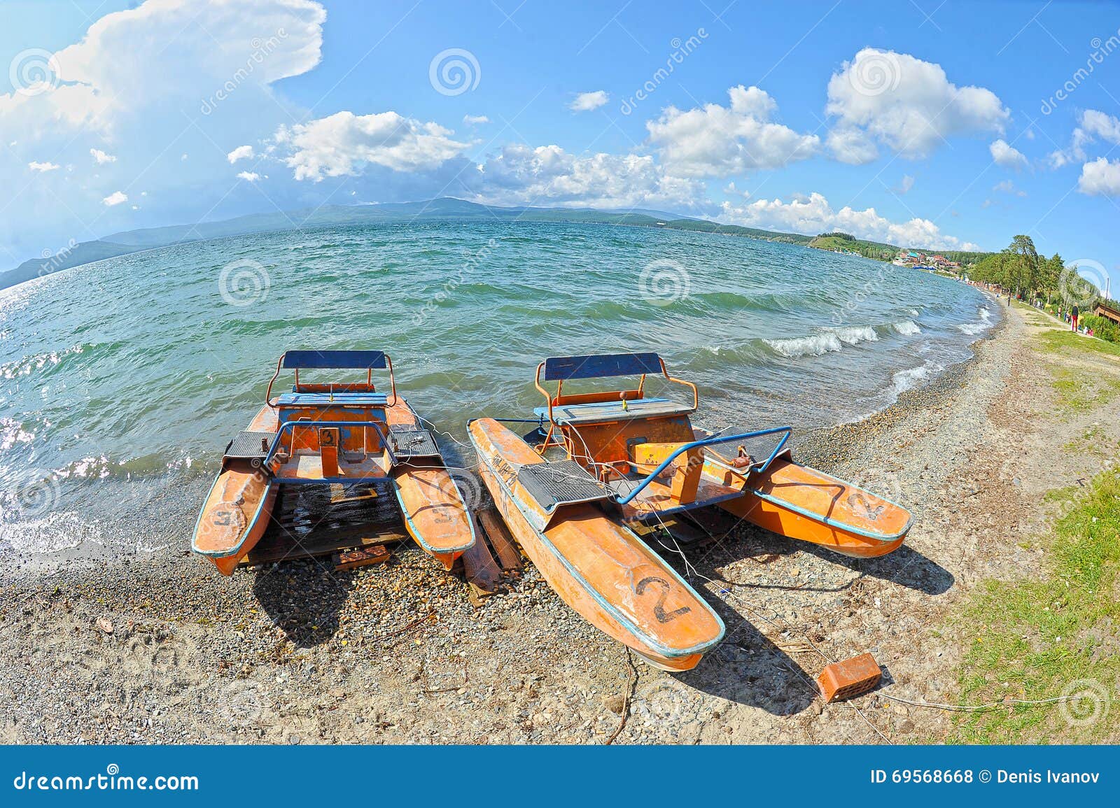Old catamaran on the shore stock photo. Image of sunlight - 69568668