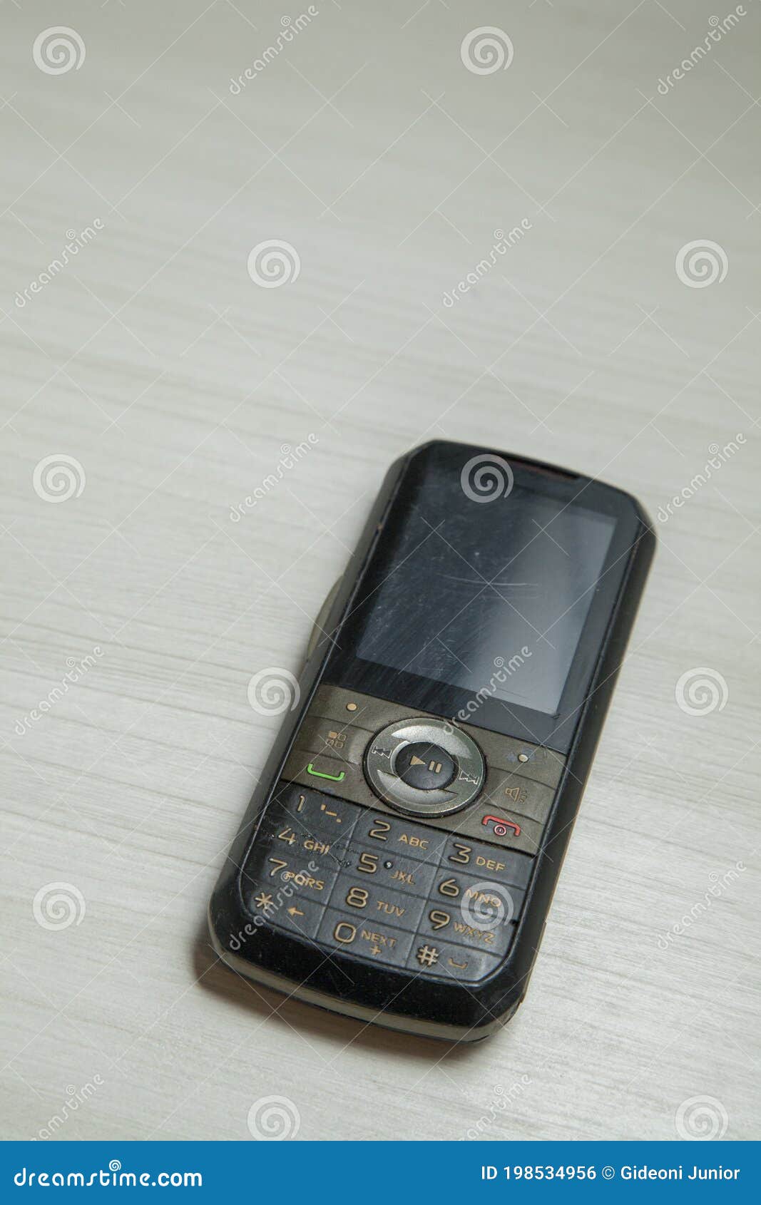 Old Cellular Device Placed on the Table Top in the Home Office Stock ...