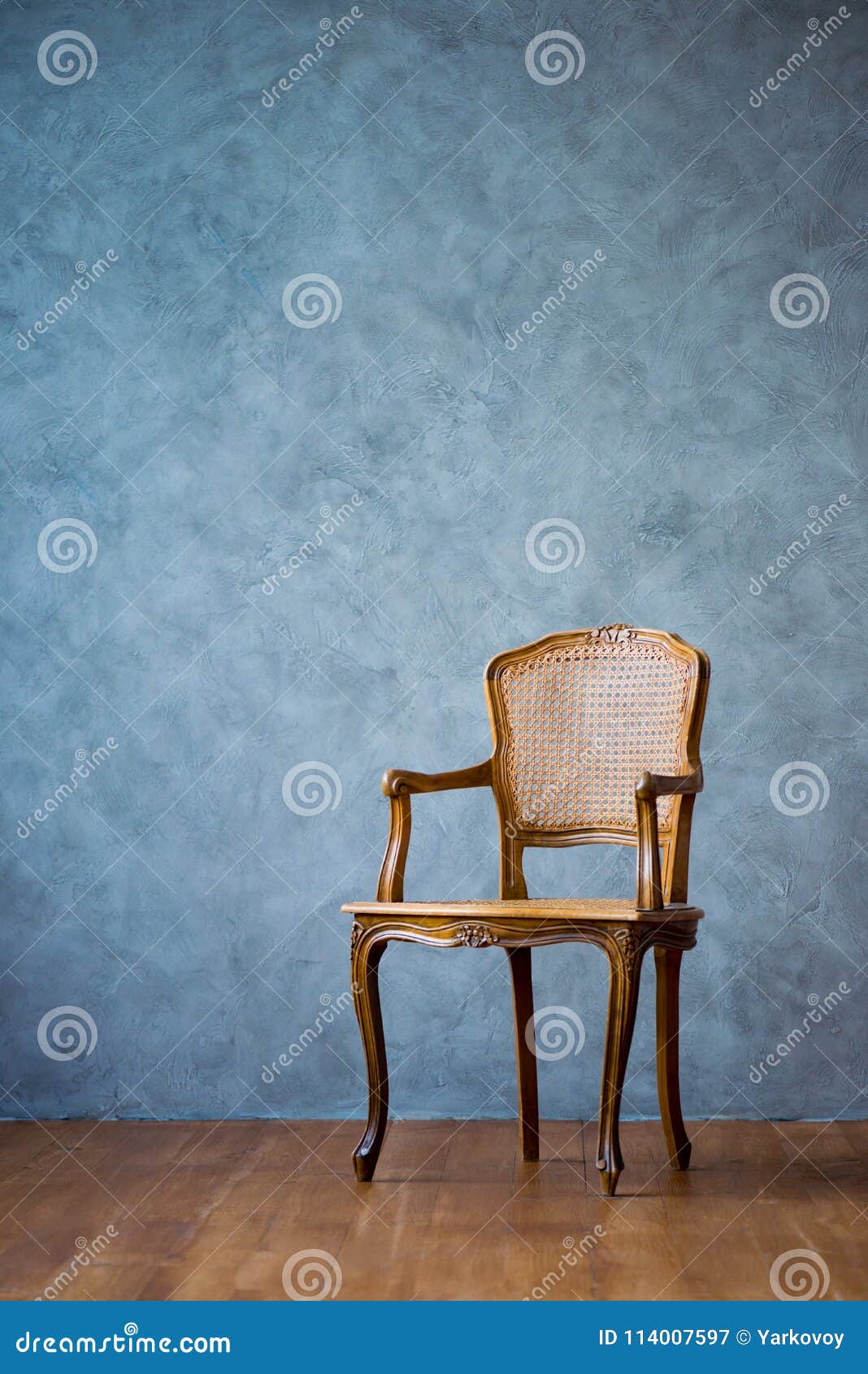 Old Chair on a Gray Wall Background. Stock Image - Image of interior ...
