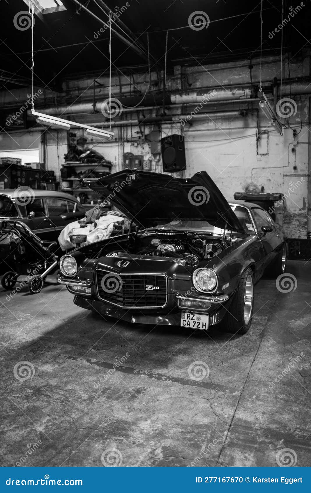 An Old Cheverolet with Open Engine Hood Stands in a Workshop Editorial ...