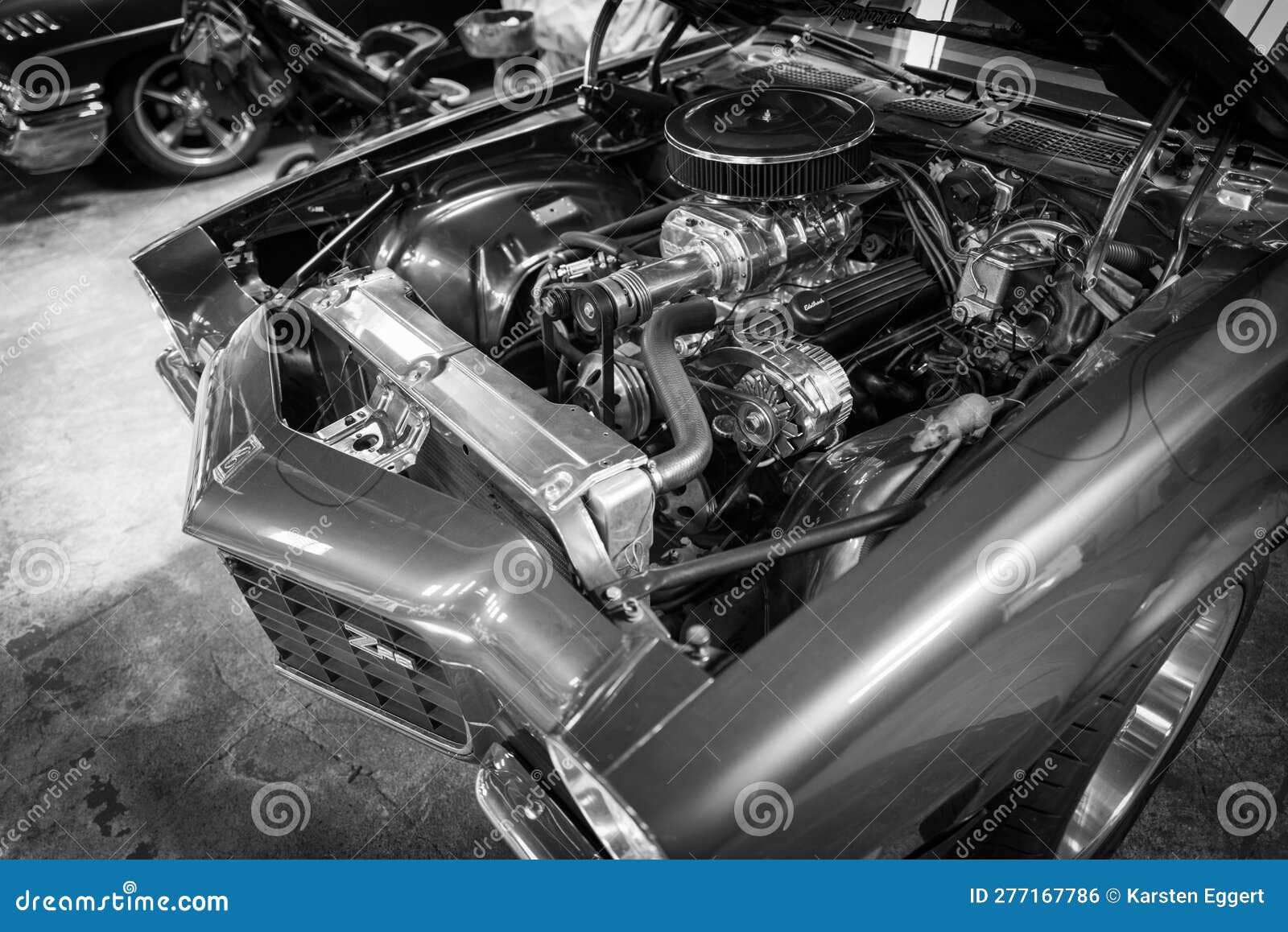 An Old Cheverolet With Open Engine Hood Stands In A Workshop Editorial ...