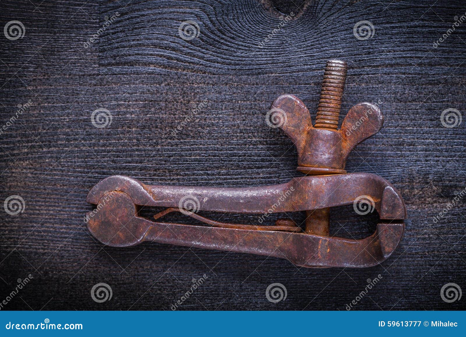 Old clamp on vintage board stock image. Image of heavy - 59613777