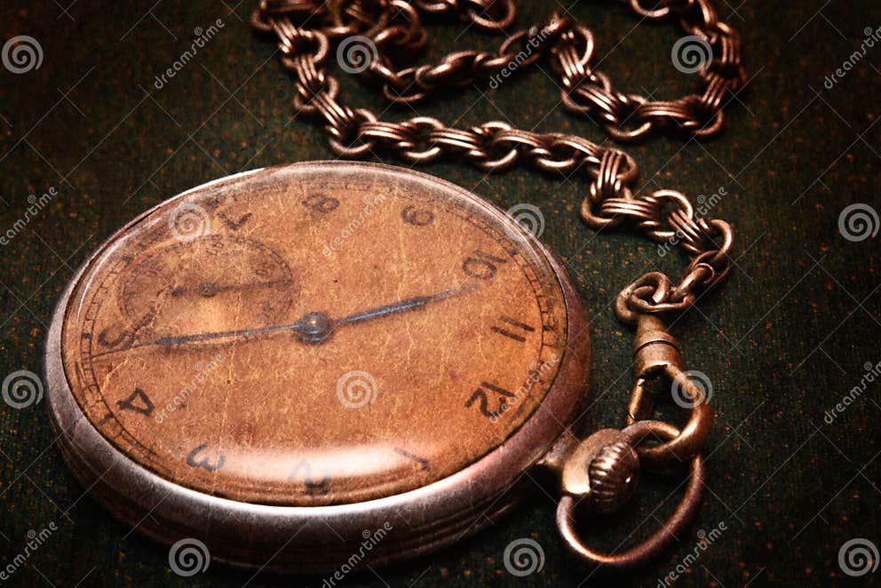 Old Clock with Chain Lying on Rough Green Surface Stock Image - Image ...