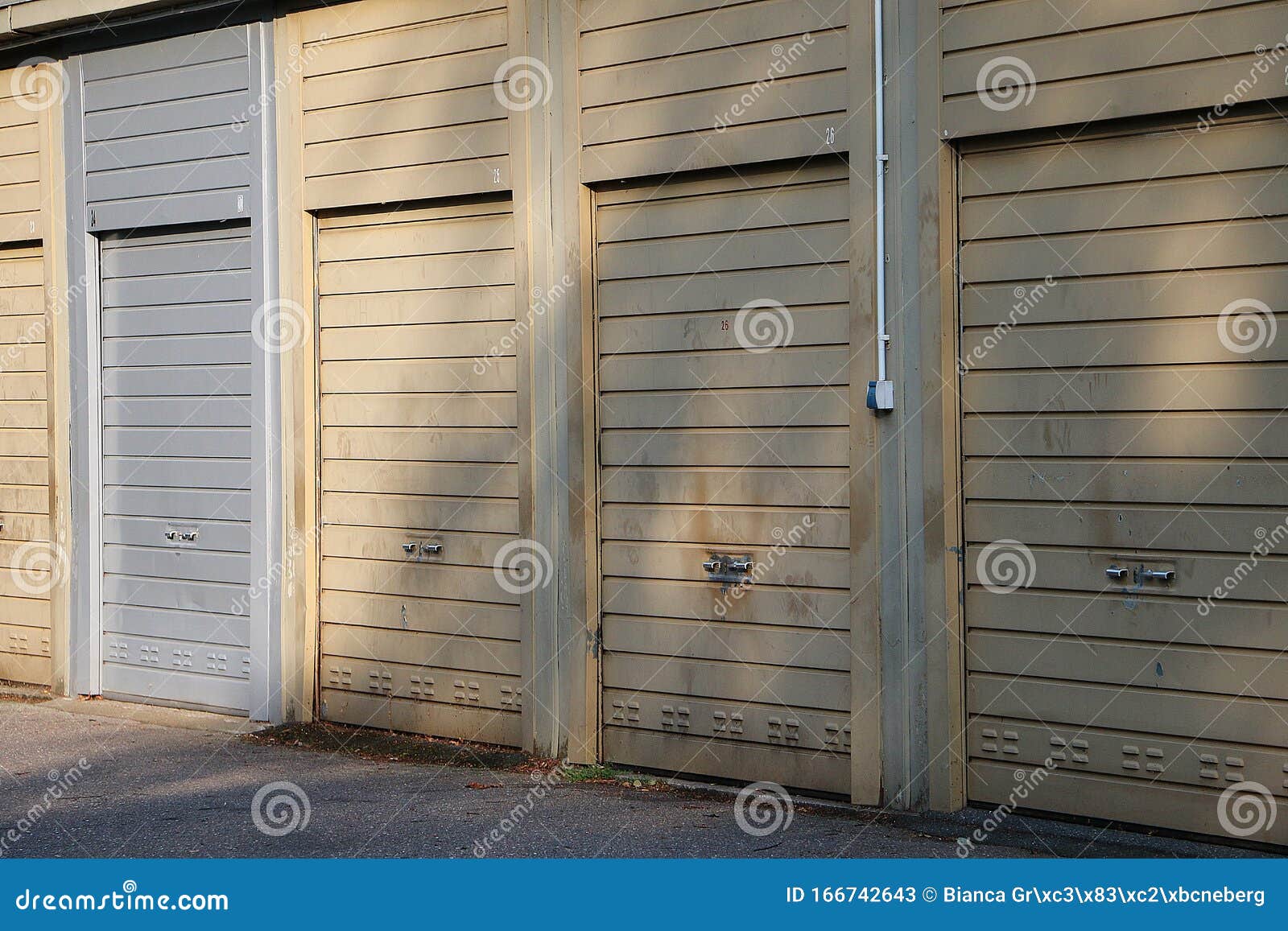 Row of old closed garages stock image. Image of suburb - 166742643