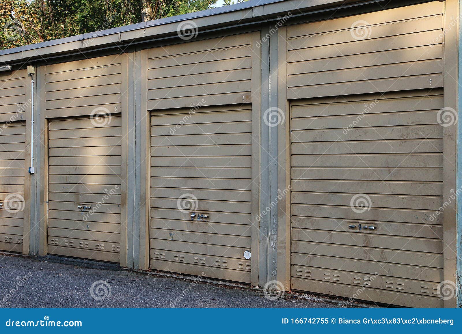 Row of old closed garages stock image. Image of outdoor - 166742755