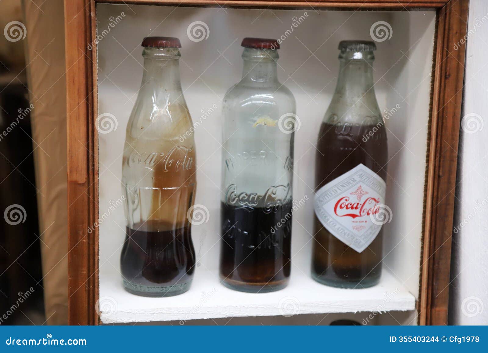 Old Coca Cola Bottles of Different Models. Soda Drinks Stock Photo ...