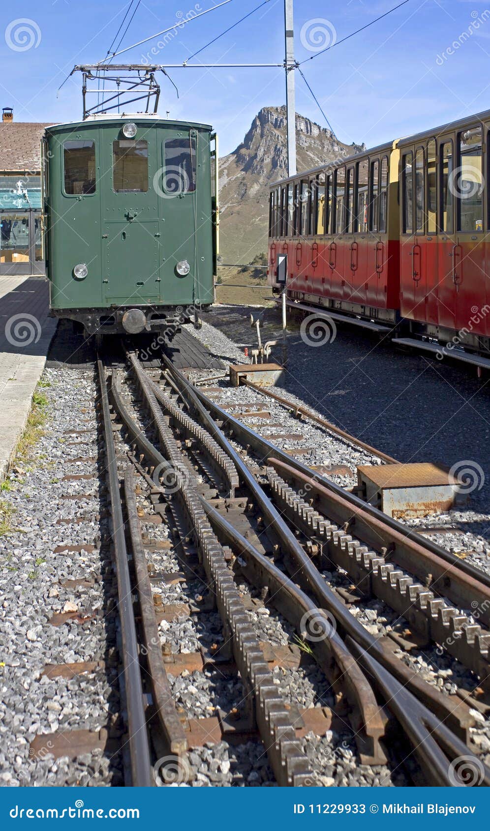 A Cog Wheel Train Traveling On The Mountain Railway From Wengen To ...