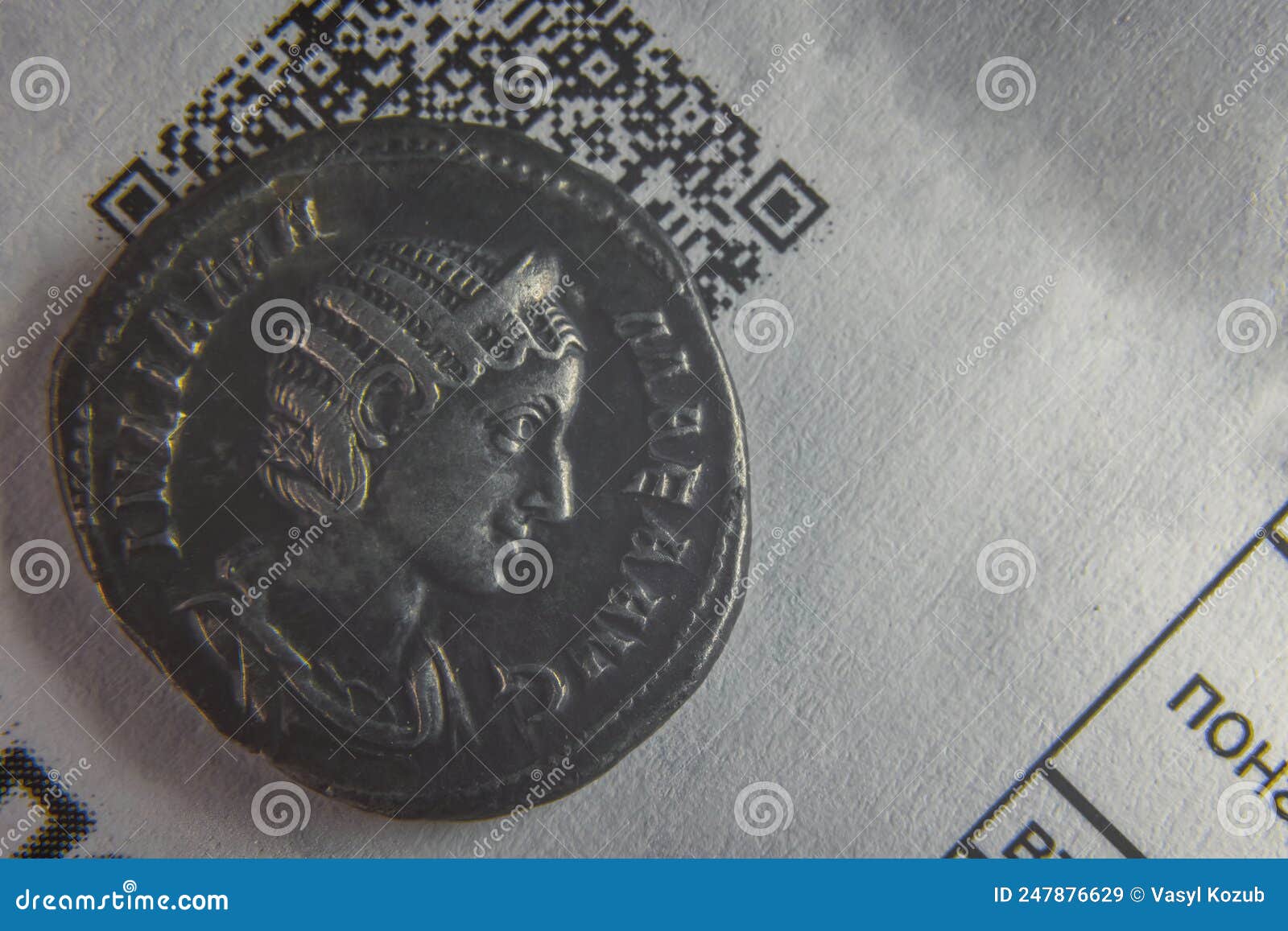 An Old Coin on a Sheet of Paper with a Cuar Code Stock Image - Image of ...