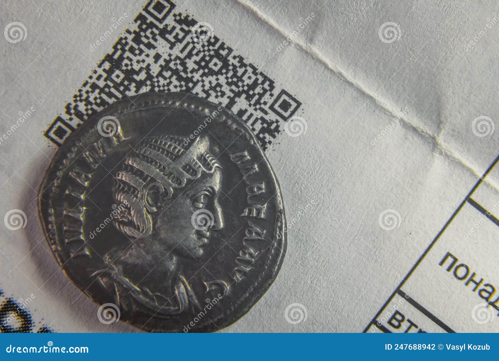 An Old Coin on a Sheet of Paper with a Cuar Code Stock Photo - Image of ...